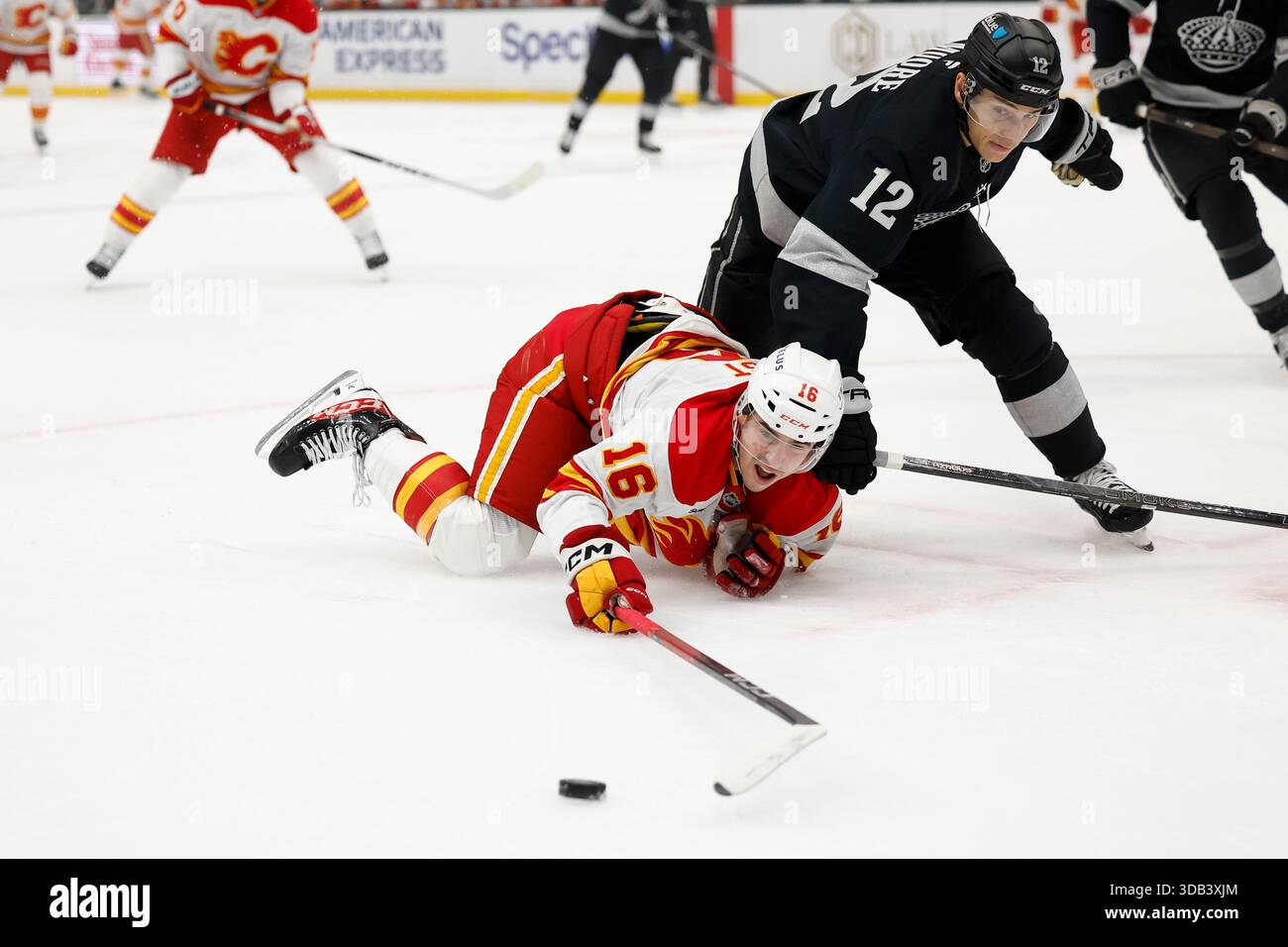 Calgary Flames center Morgan Frost (16) and Los Angeles Kings left wing ...