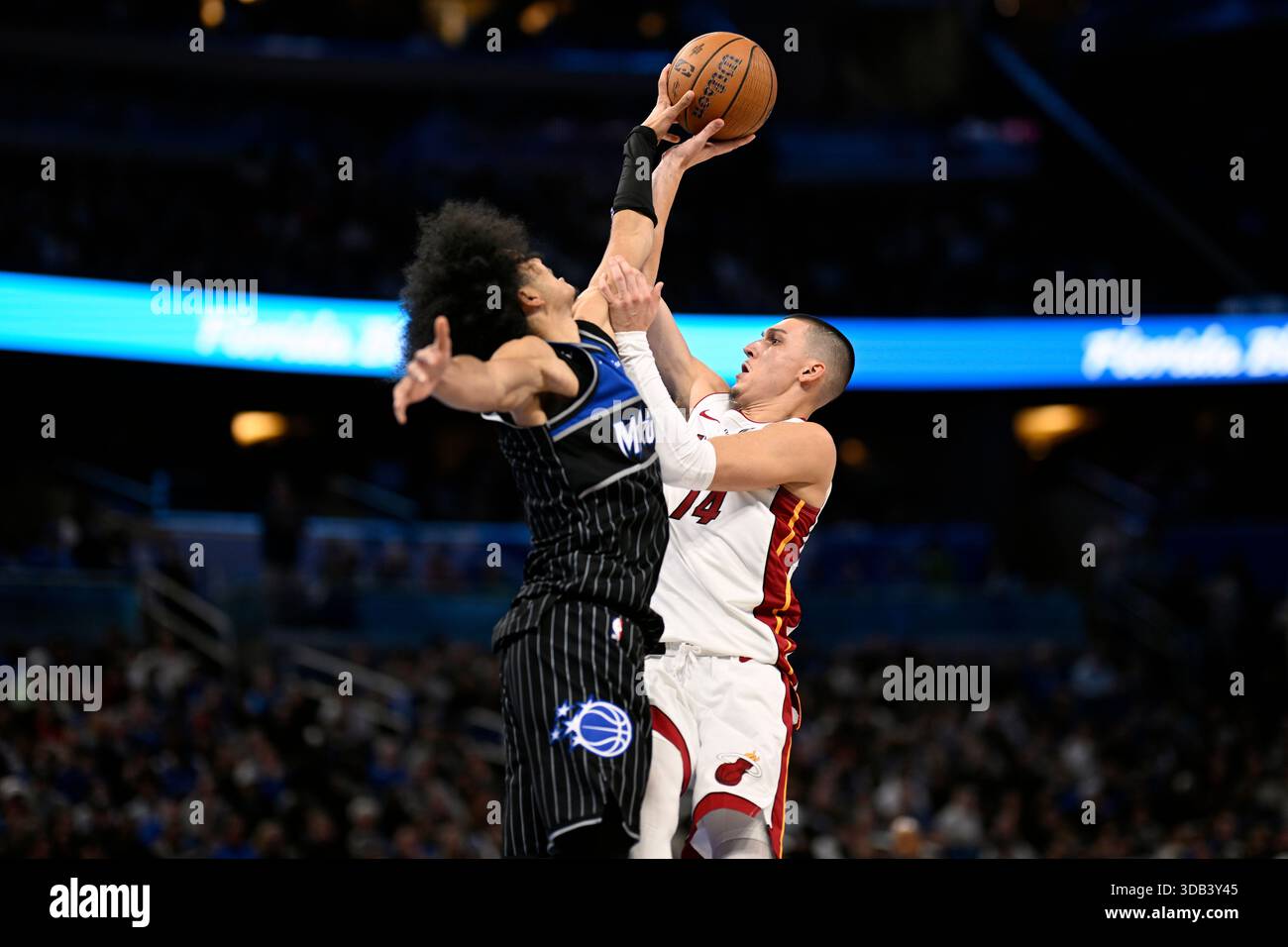 Miami Heat guard Tyler Herro (14) has his shot blocked by Orlando Magic ...