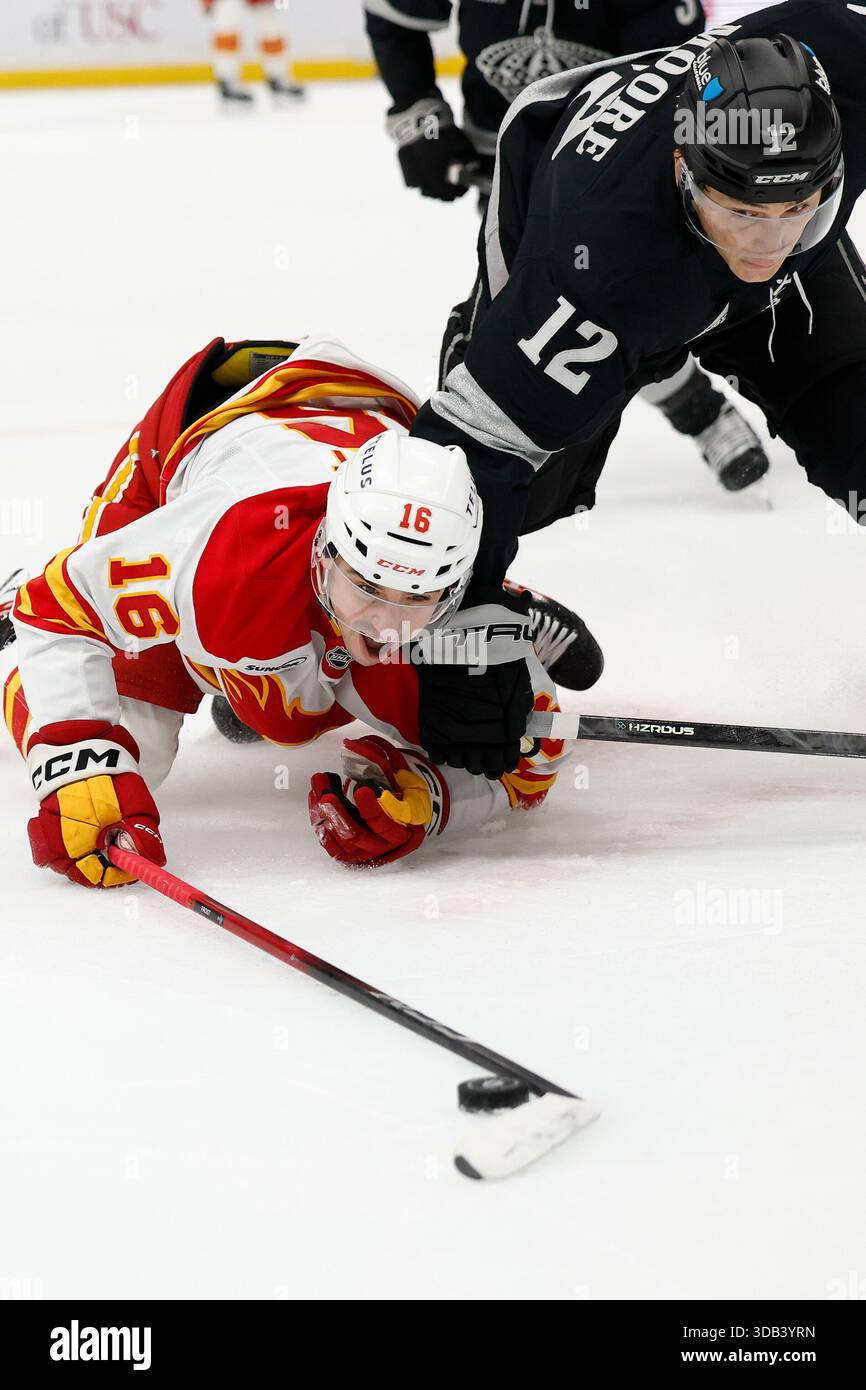 Calgary Flames center Morgan Frost (16) and Los Angeles Kings left wing ...
