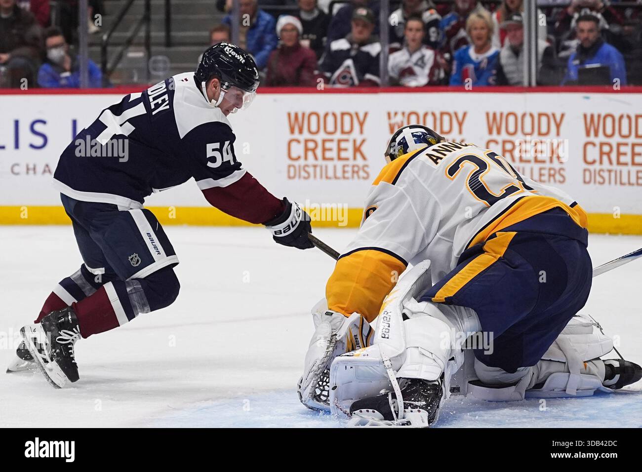 Colorado Avalanche center Gavin Brindley, left, puts a shot on ...