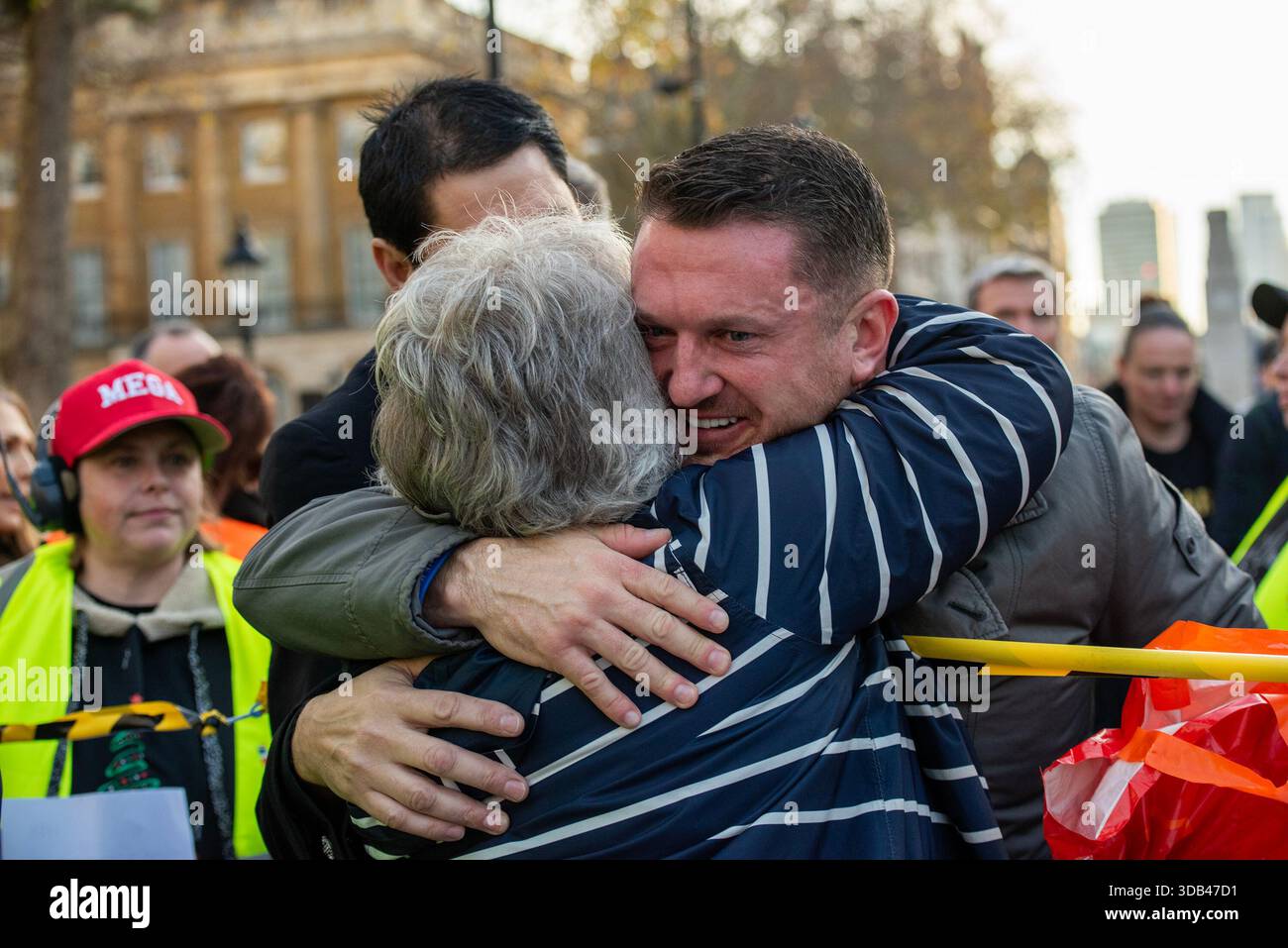 Tommy Robinson hugs one of his follower during the Christmas service ...