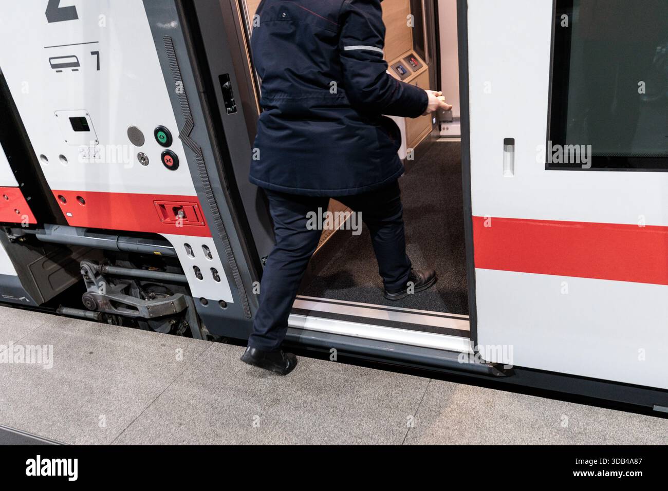 14 December 2025, Berlin: Train crew board the new Deutsche Bahn ICE-L ...