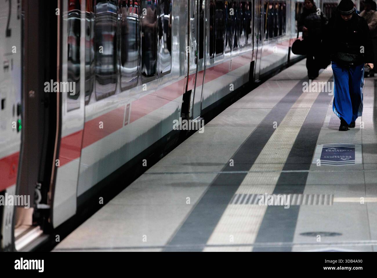 14 December 2025, Berlin: Passengers board the new Deutsche Bahn ICE-L ...
