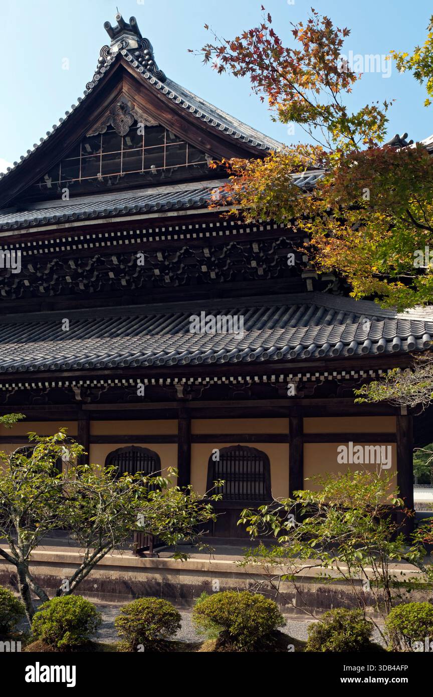 Bell-shaped windows on the mustard-colored side of Zen Buddhist ...