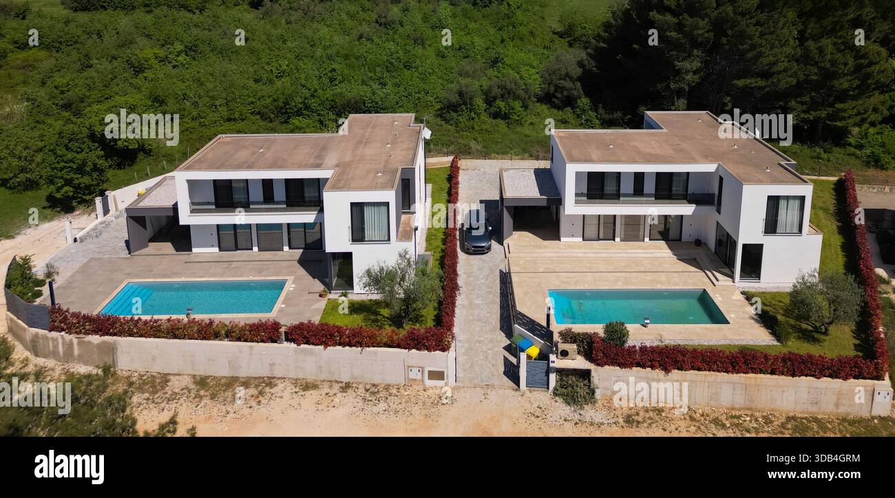 Aerial view of two stunning modern luxury villas with private swimming ...