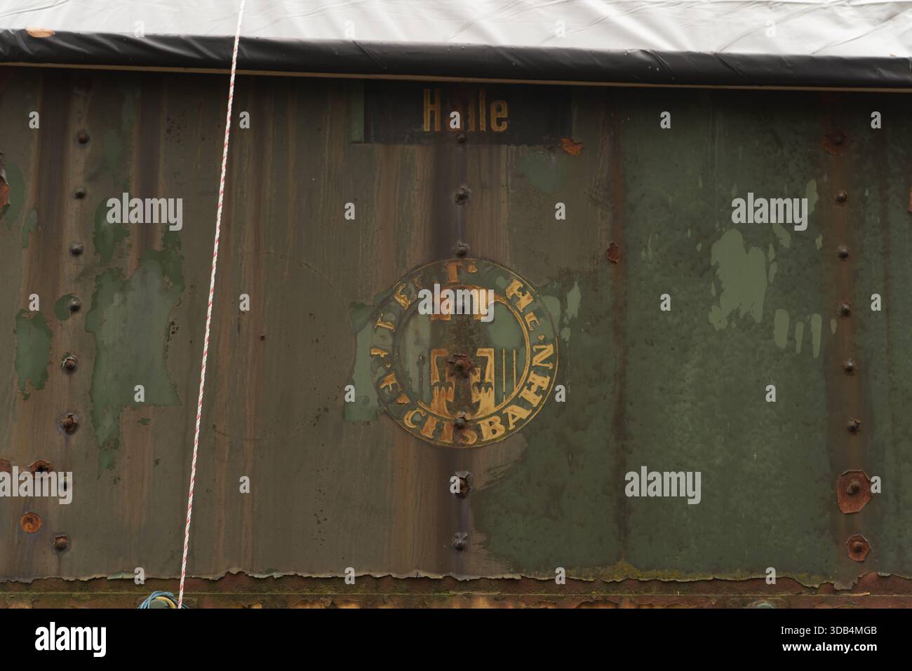 Weathered green railcar side with peeling paint, rivets and historic ...