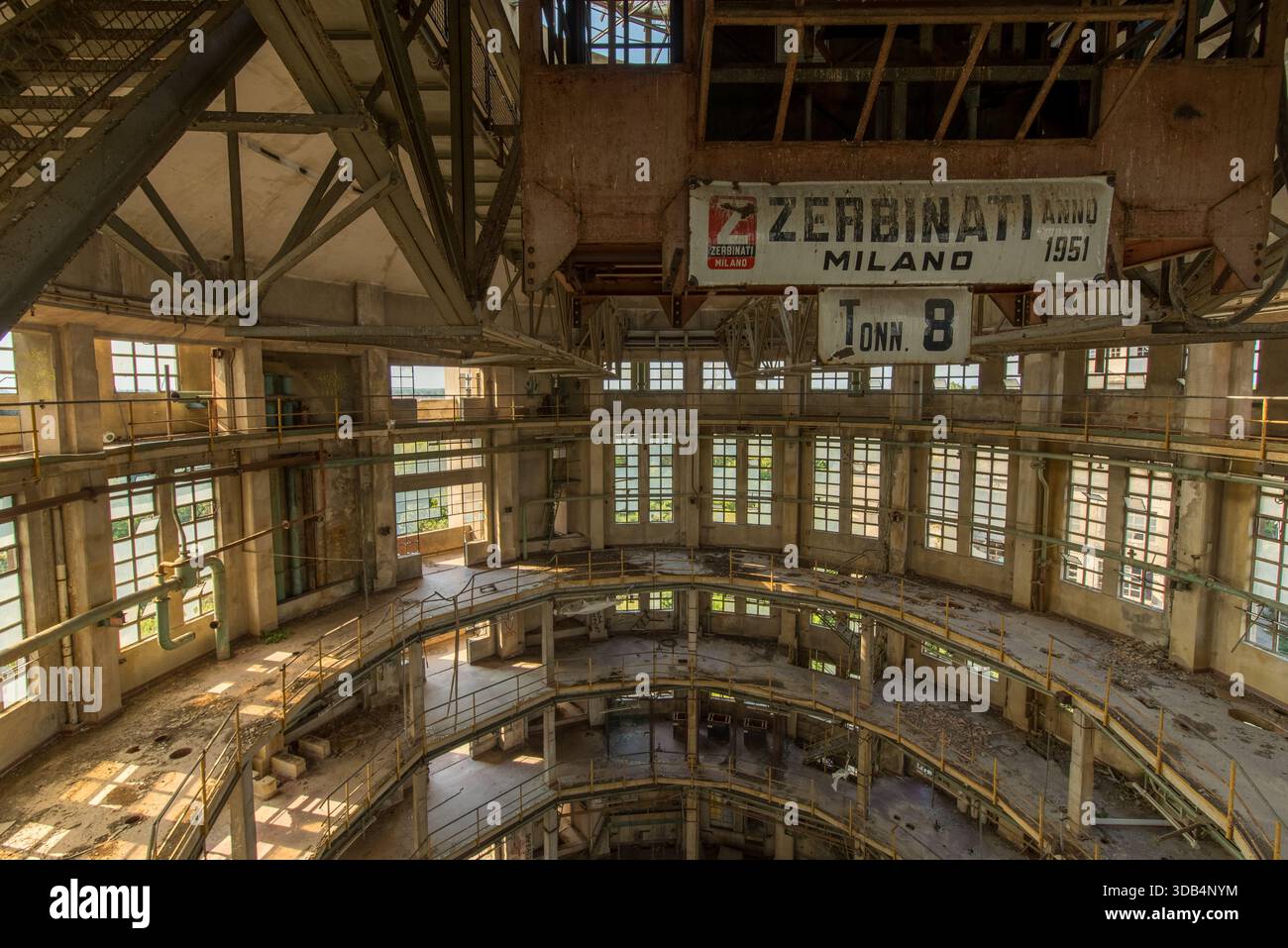 Circular abandoned factory interior with Zerbinati Milano crane sign ...