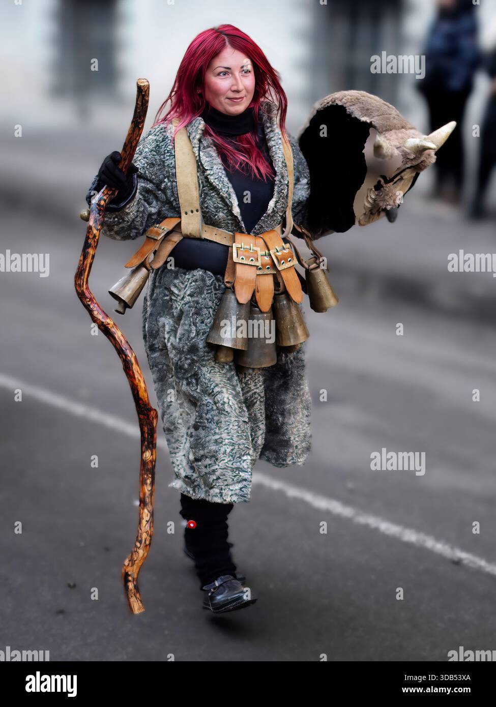 Crowd of Bulgarian Survakari performers in traditional fur costumes and ...