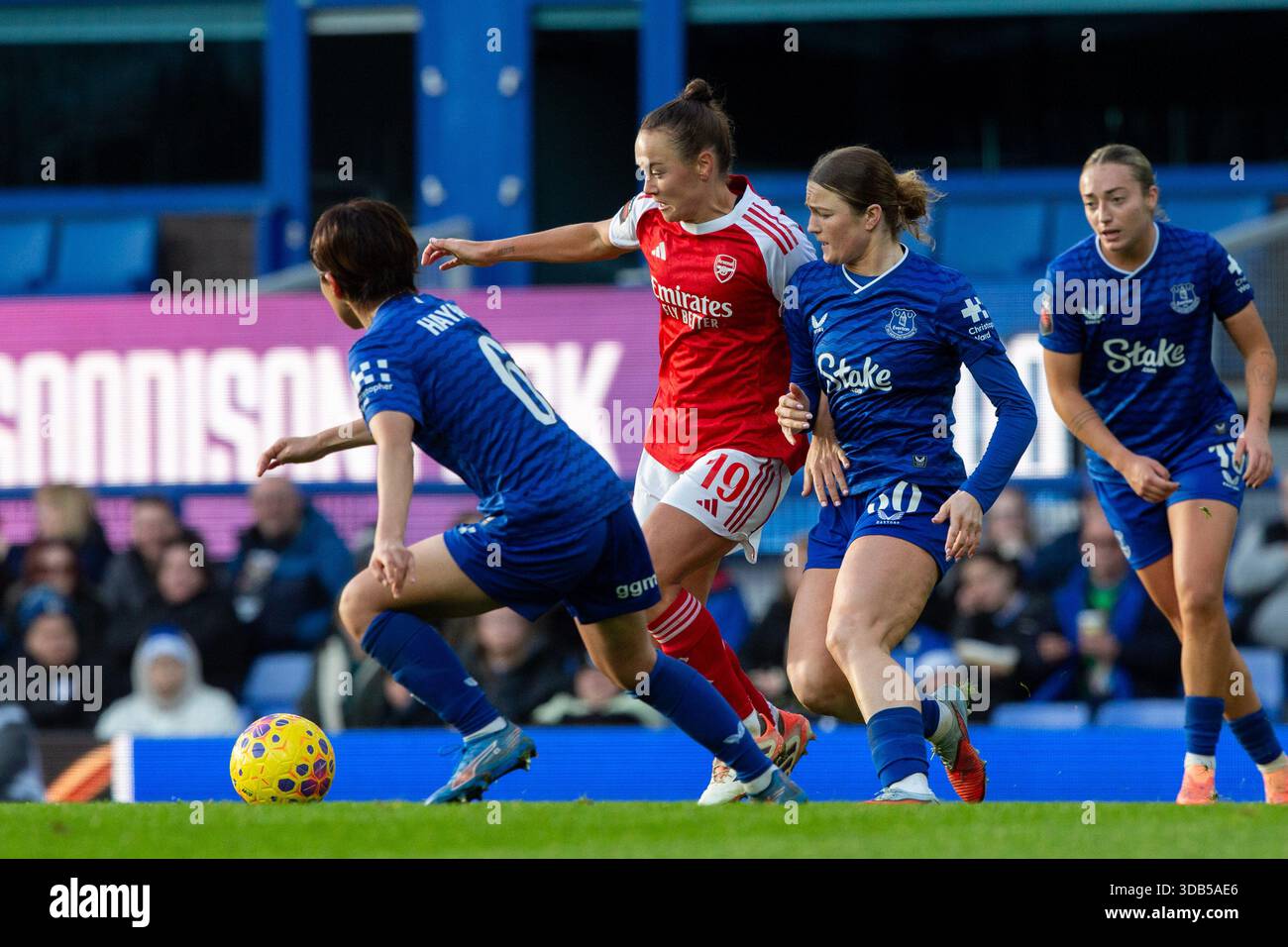 Caitlin Foord (19 Arsenal) under pressure from Ruby Mace (30 Everton ...
