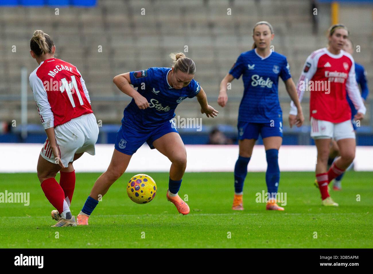 Ornella Vigonla (18 Everton) dribbles passes Katie McCabe (11 Arsenal ...