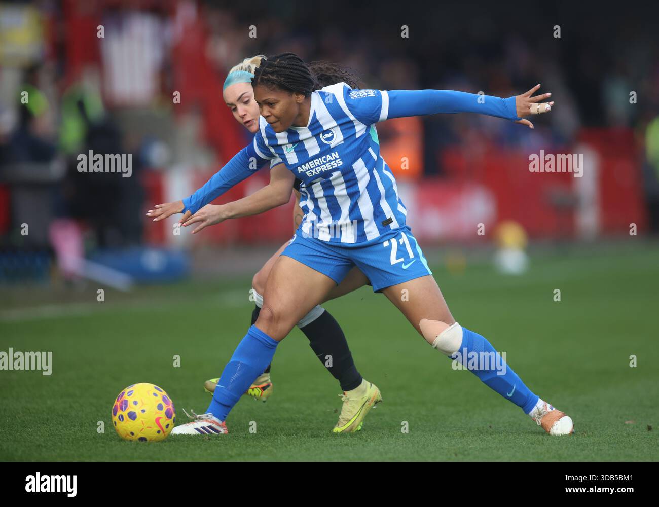 Brighton and Hove Albion's Madison Haley battles for the ball with ...