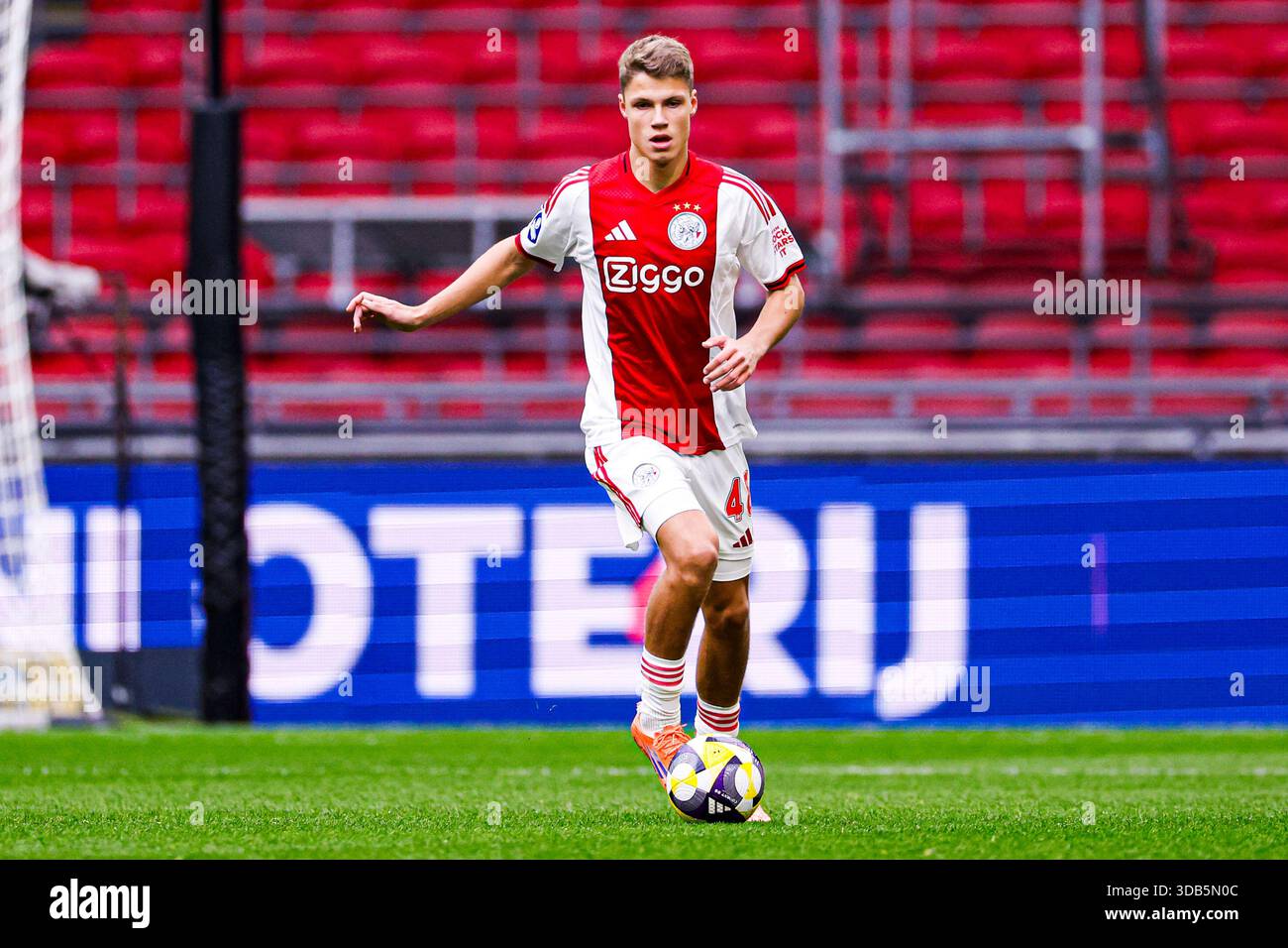 Sean Steur of AFC Ajax runs with the ball during the Dutch Eredivisie ...