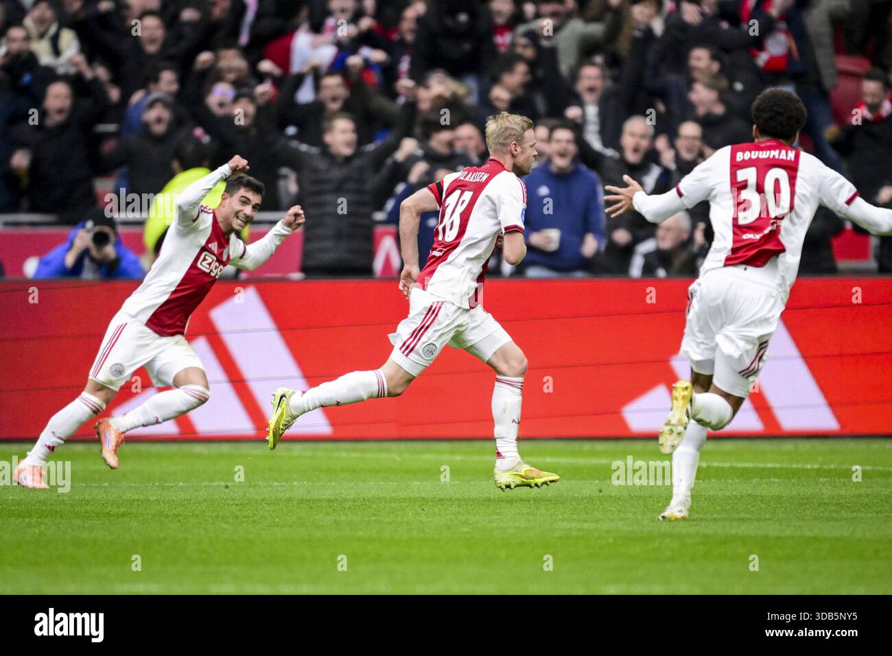 AMSTERDAM – (l-r) Oscar Gloukh of Ajax, Davy Klaassen of Ajax, and ...