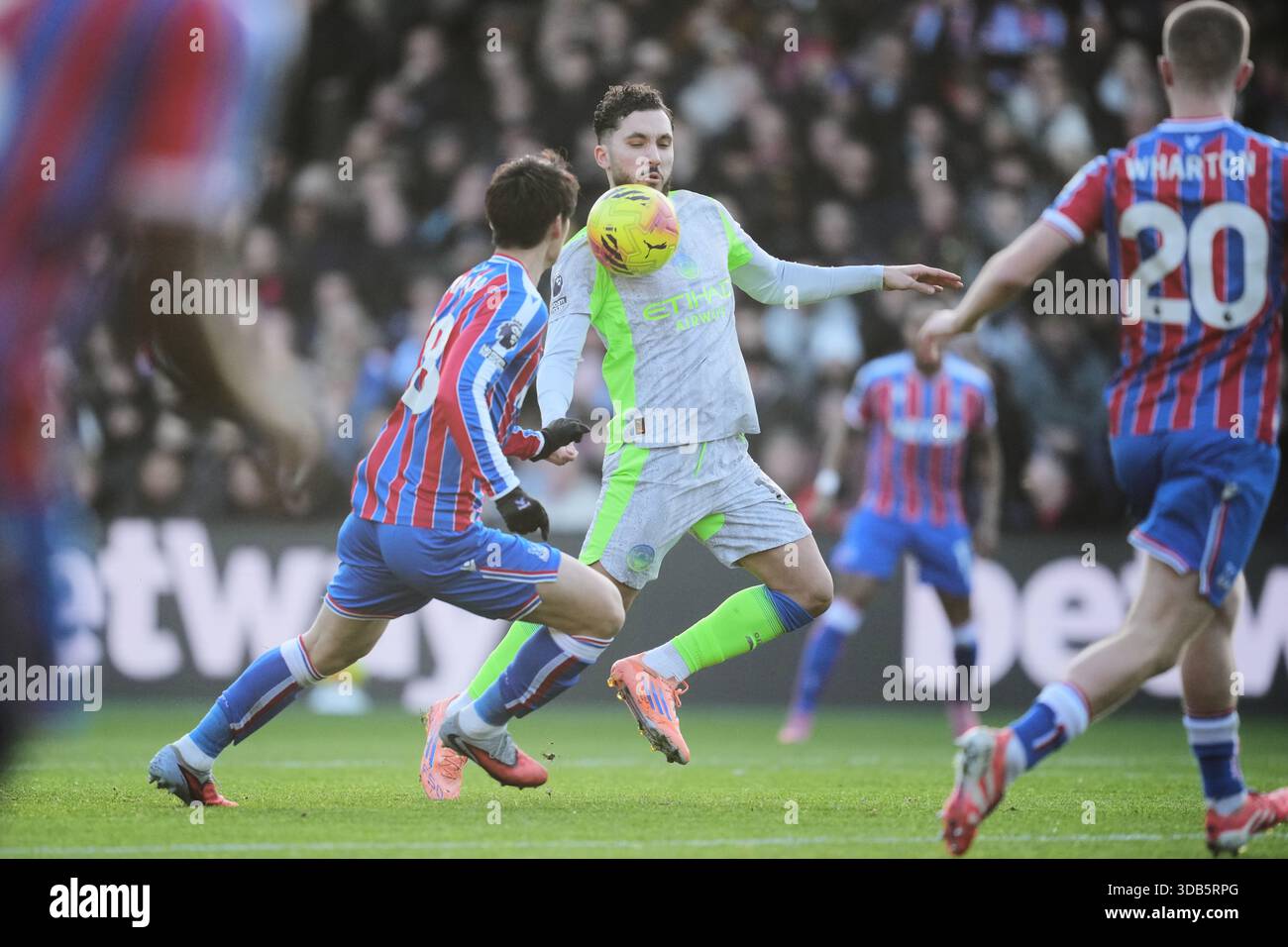 Crystal Palace's Daichi Kamada, left, challenges for the ball with ...