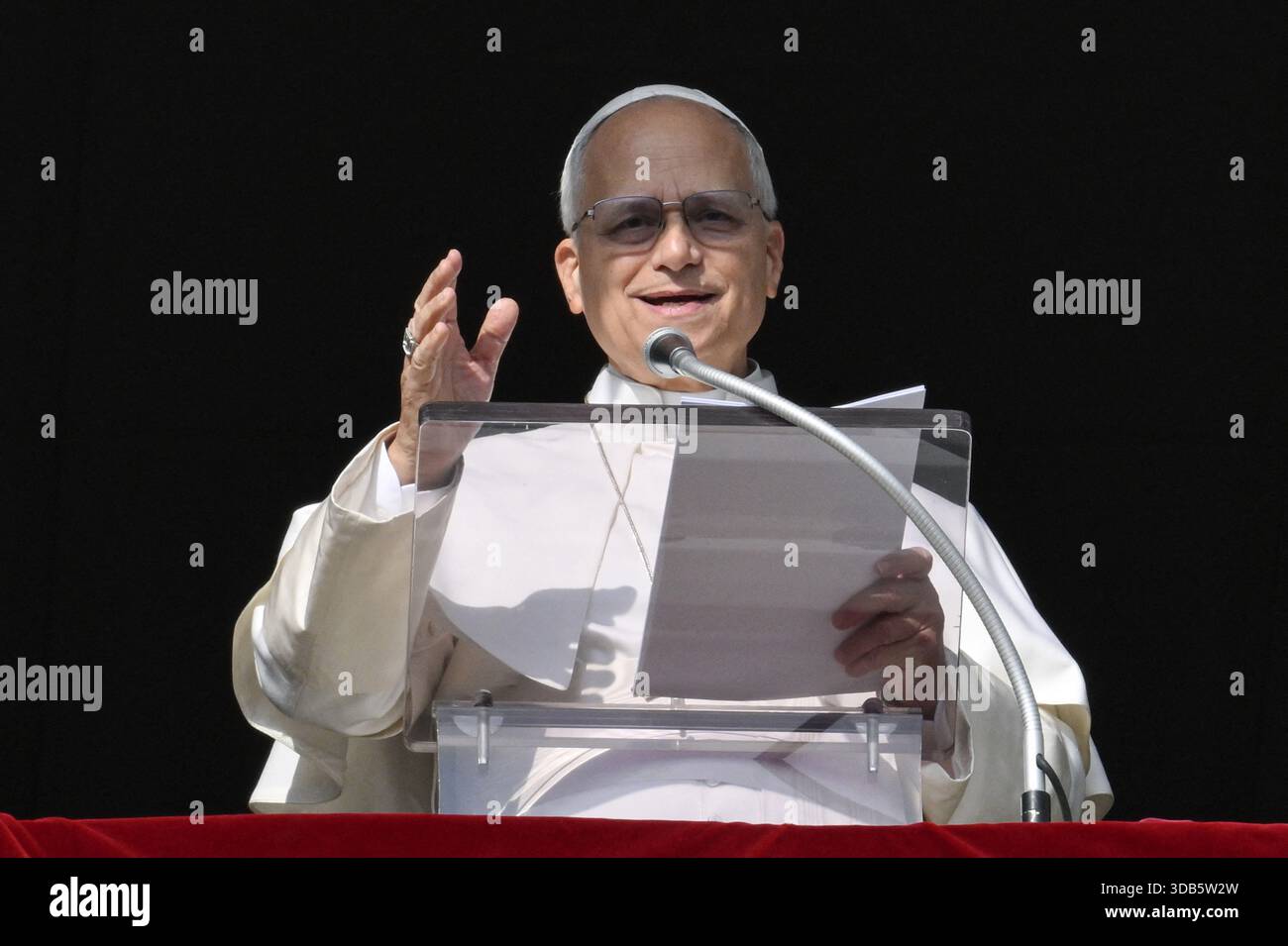 Pope Leo XIV leads the Angelus prayer from the window of the Apostolic ...