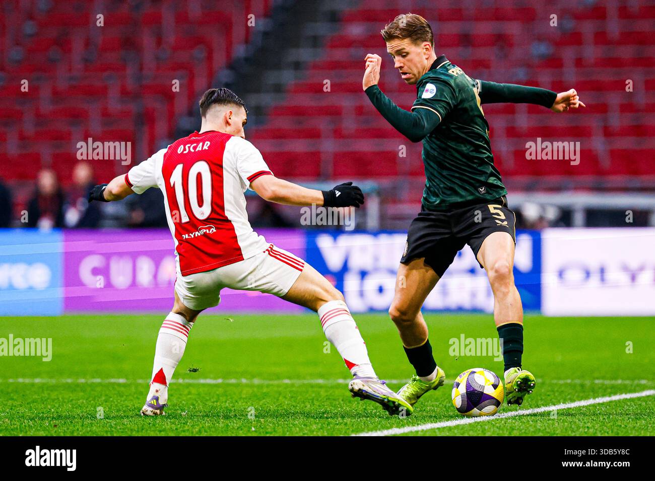 Gijs Smal of Feyenoord Rotterdam battles for possession with Oscar ...
