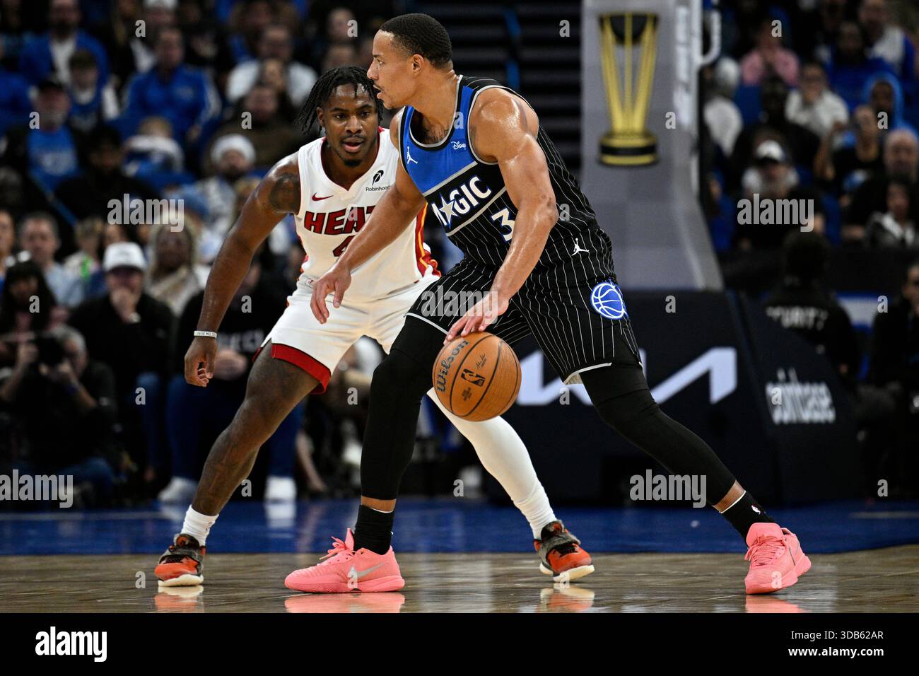 Orlando Magic guard Desmond Bane (3) is defended by Miami Heat guard ...
