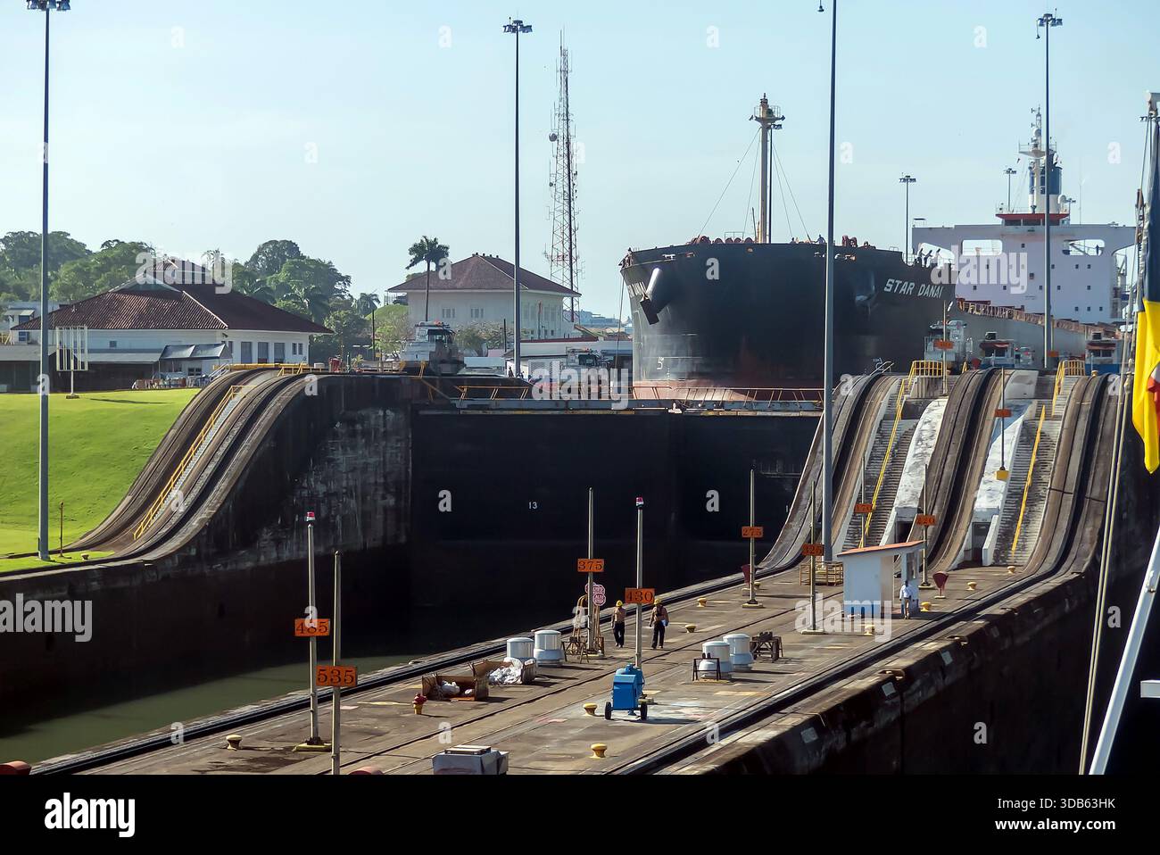 Transiting the Panama Canal: a large ship negotiating the Gatun Locks ...