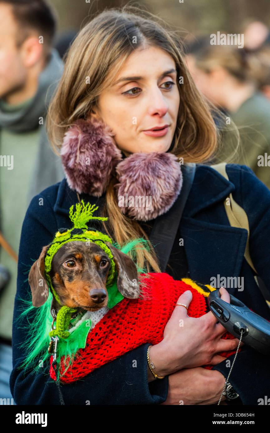 London, UK. 14 Dec 2025. One of the many Grinches - Hyde Park Sausage ...