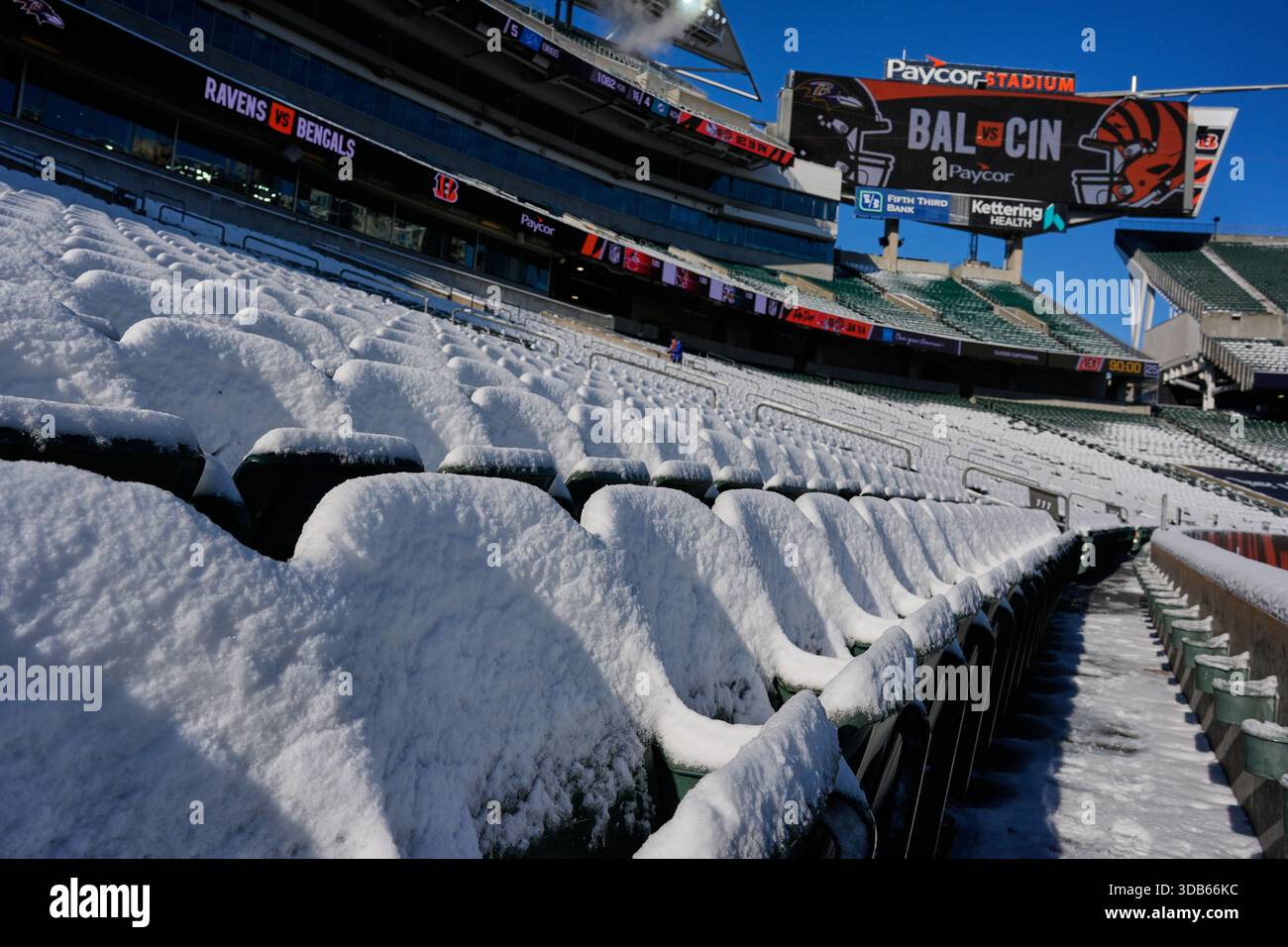Stadium seats are covered in snow before an NFL football game between ...