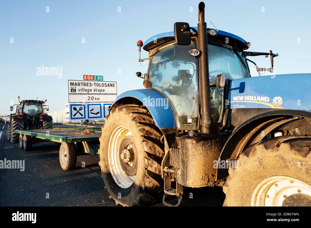Tractors with road signs, A64 - E80, Marche-Toulousaine. On the farmers ...