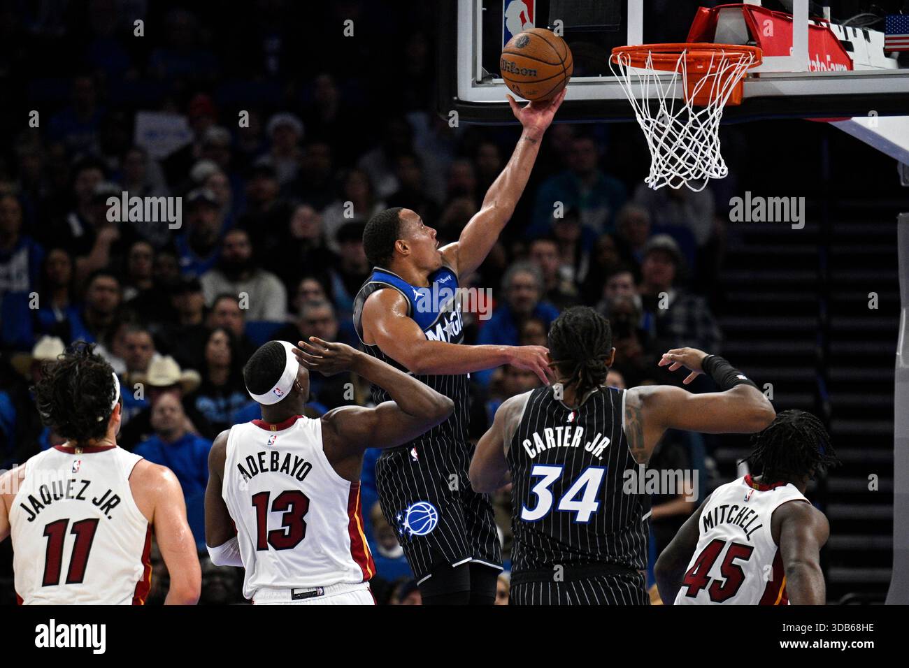 Orlando Magic guard Desmond Bane, center, goes up to shoot against the ...
