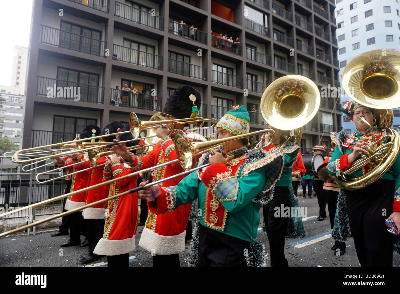 People gather to watch a Christmas parade in Sao Paulo, Brazil, 13 ...