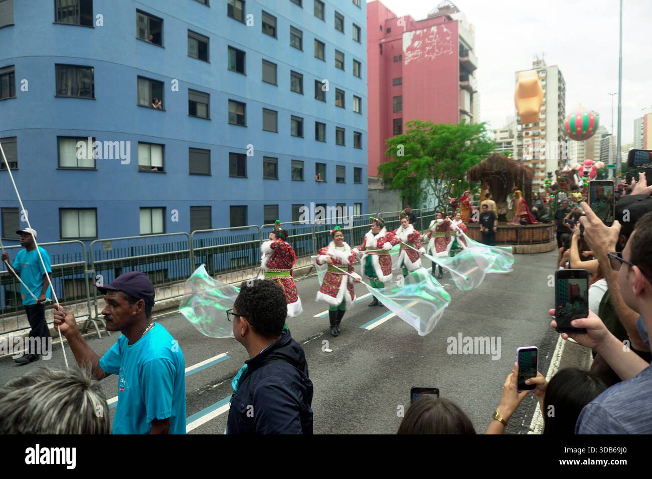 People gather to watch a Christmas parade in Sao Paulo, Brazil, 13 ...