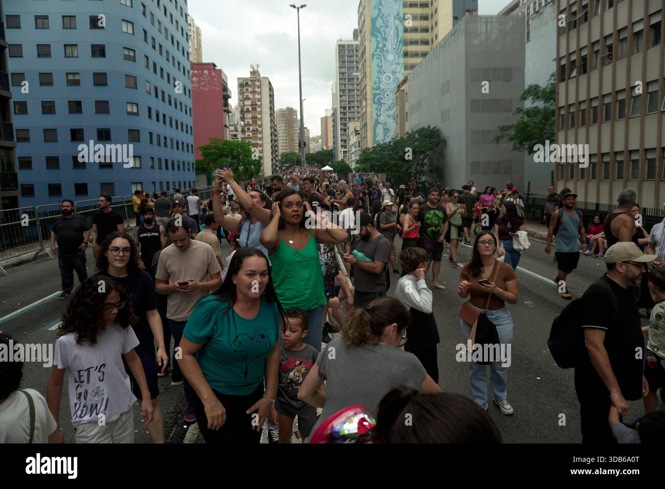 People gather to watch a Christmas parade in Sao Paulo, Brazil, 13 ...