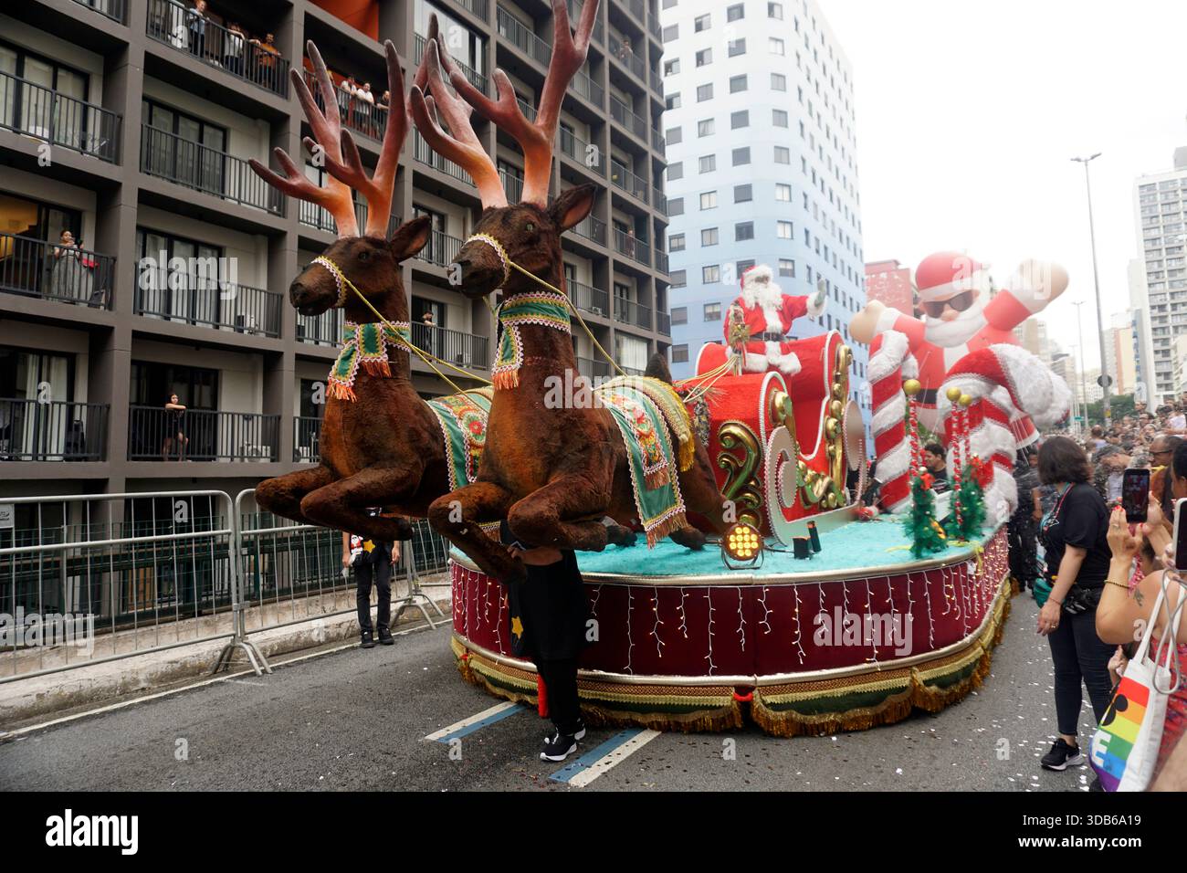 People gather to watch a Christmas parade in Sao Paulo, Brazil, 13 ...