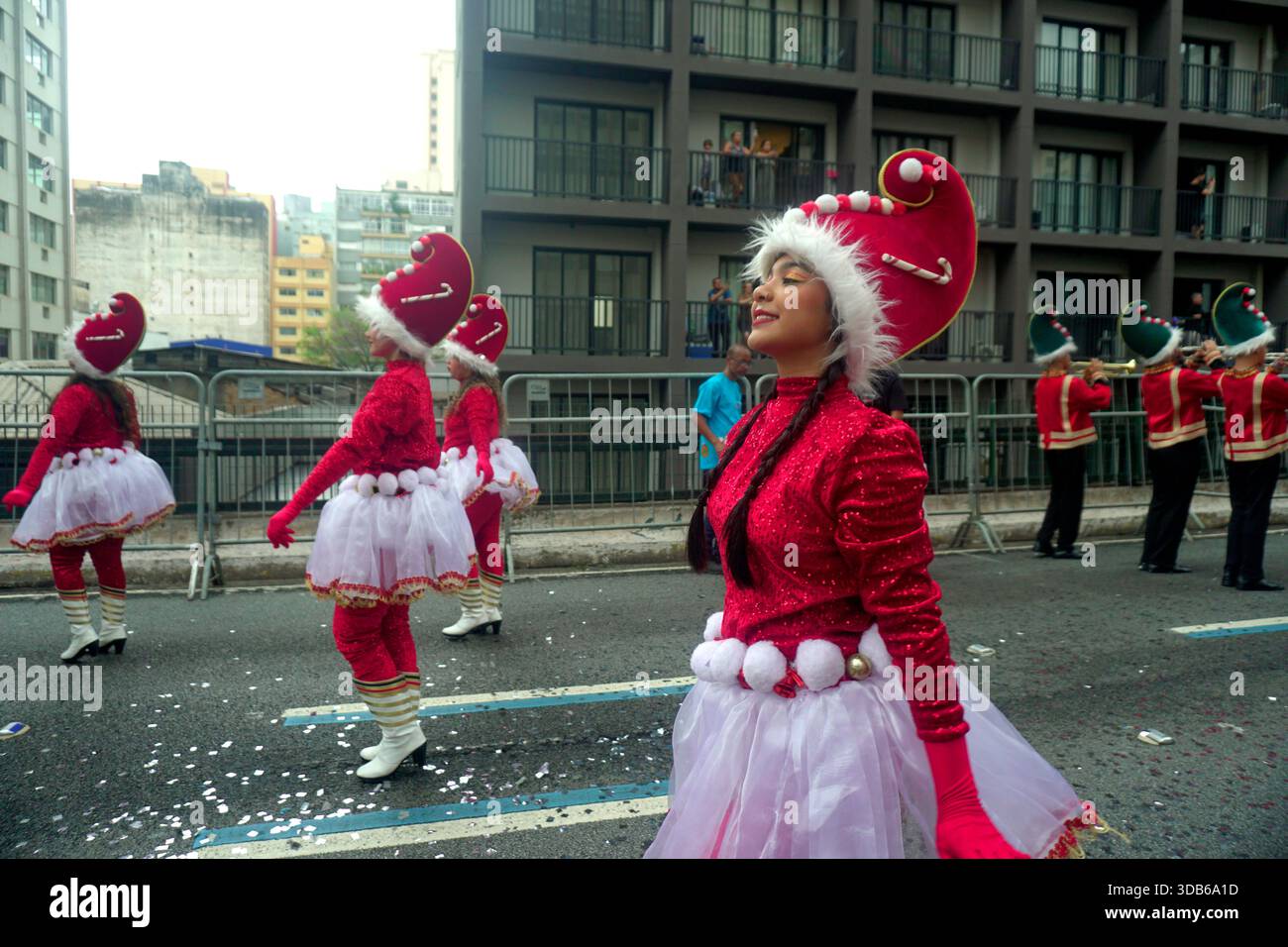 People gather to watch a Christmas parade in Sao Paulo, Brazil, 13 ...
