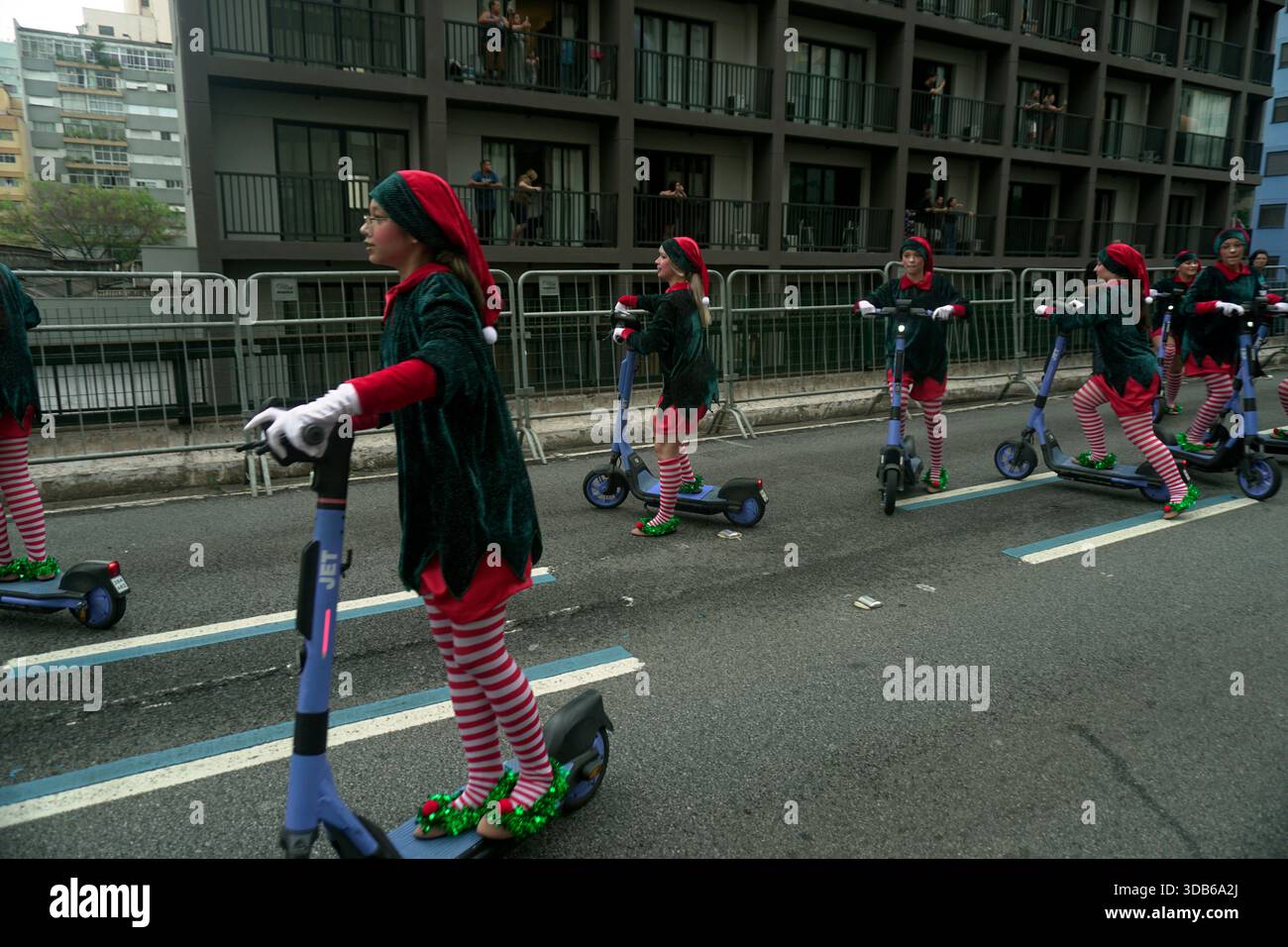 People gather to watch a Christmas parade in Sao Paulo, Brazil, 13 ...