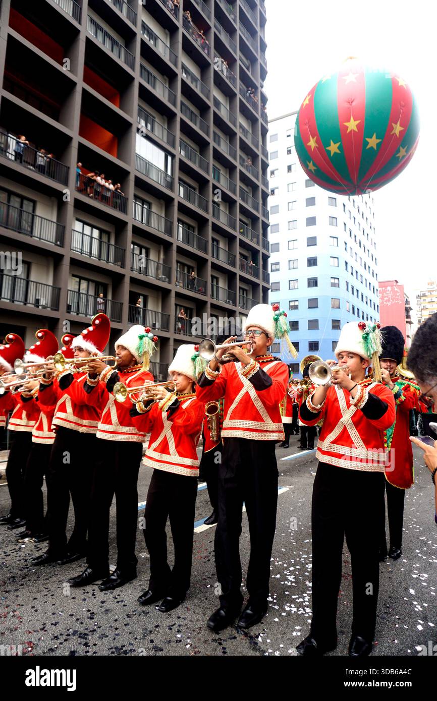 People gather to watch a Christmas parade in Sao Paulo, Brazil, 13 ...