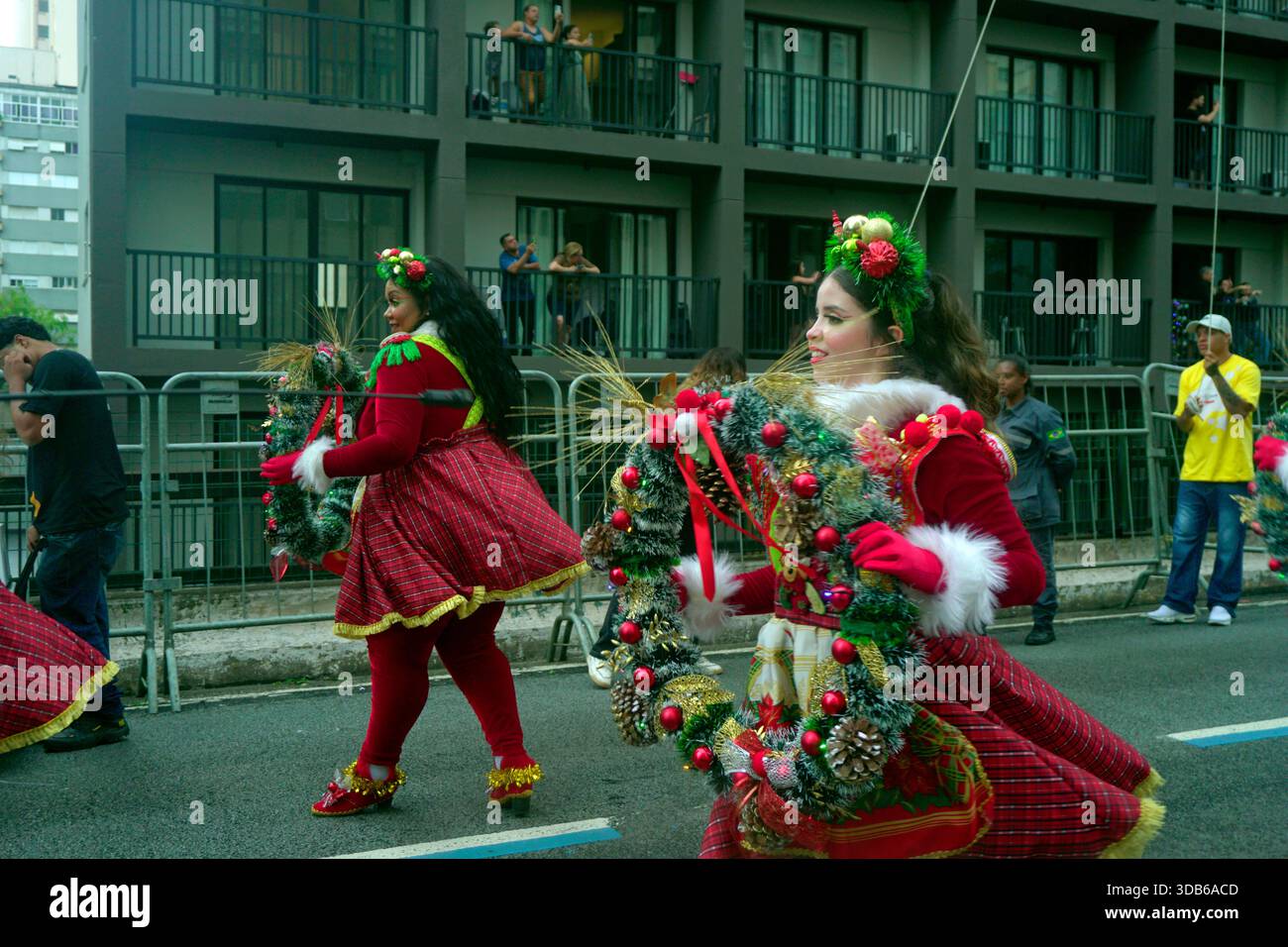 People gather to watch a Christmas parade in Sao Paulo, Brazil, 13 ...