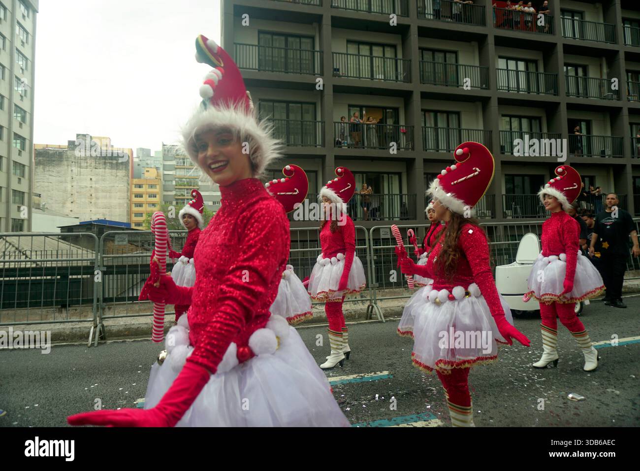 People gather to watch a Christmas parade in Sao Paulo, Brazil, 13 ...