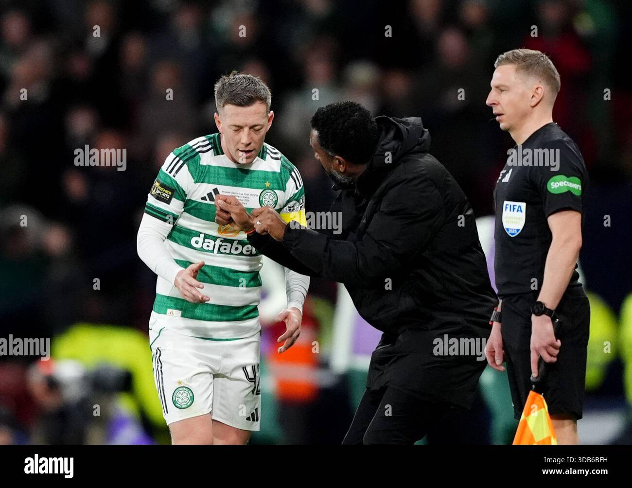 Celtic manager Wilfried Nancy (right) speaks with captain Callum ...