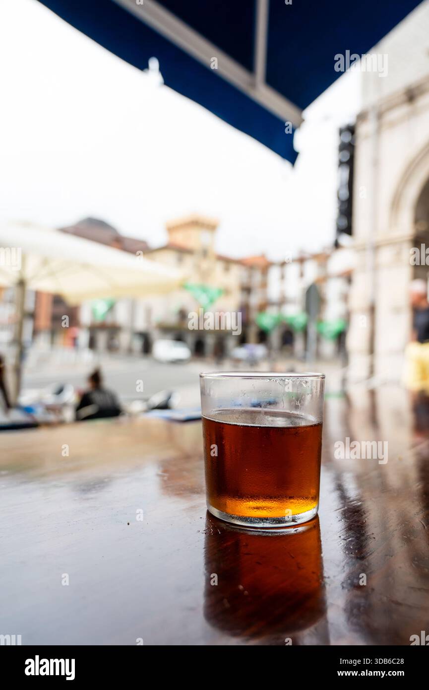 Sitting at a table in front of an open window hi-res stock photography ...