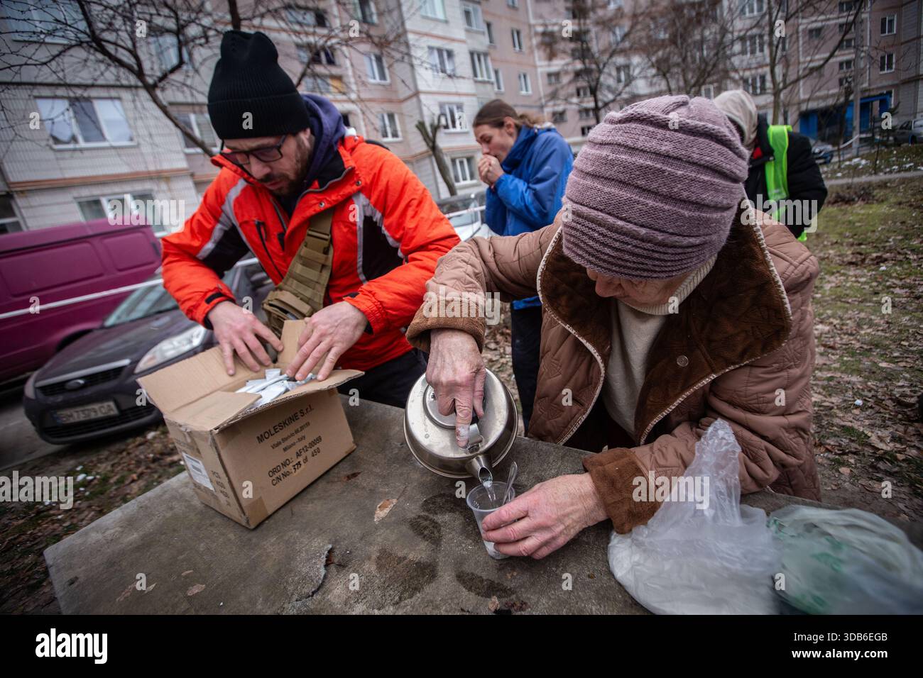 December 14, 2025, Sumy, Sumy, Ukraine: A resident of Sumy serves tea ...