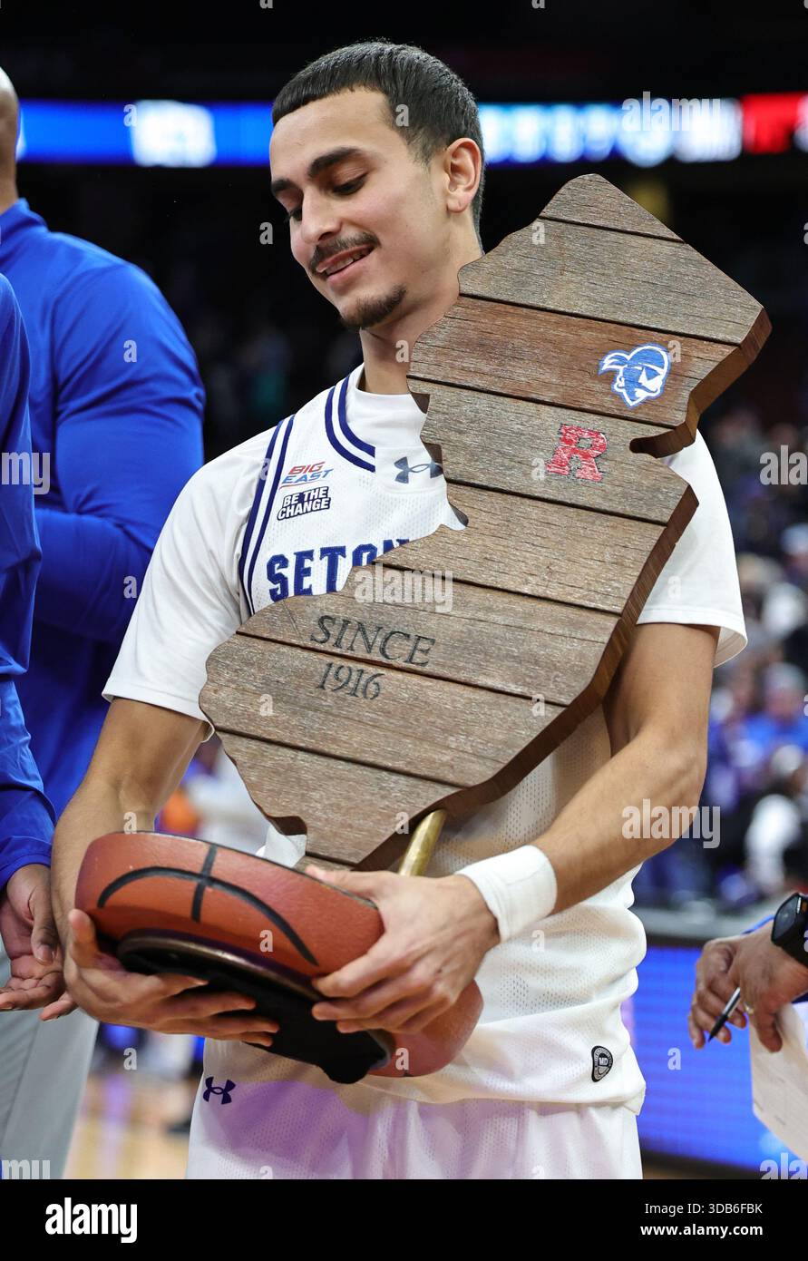 Seton Hall guard David Gabriel (41) with the trophy after the game at ...