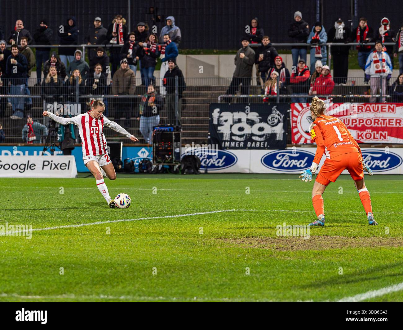 Laura Donhauser (FC Cologne, #25) taking a shot on goal, which Jasmin ...