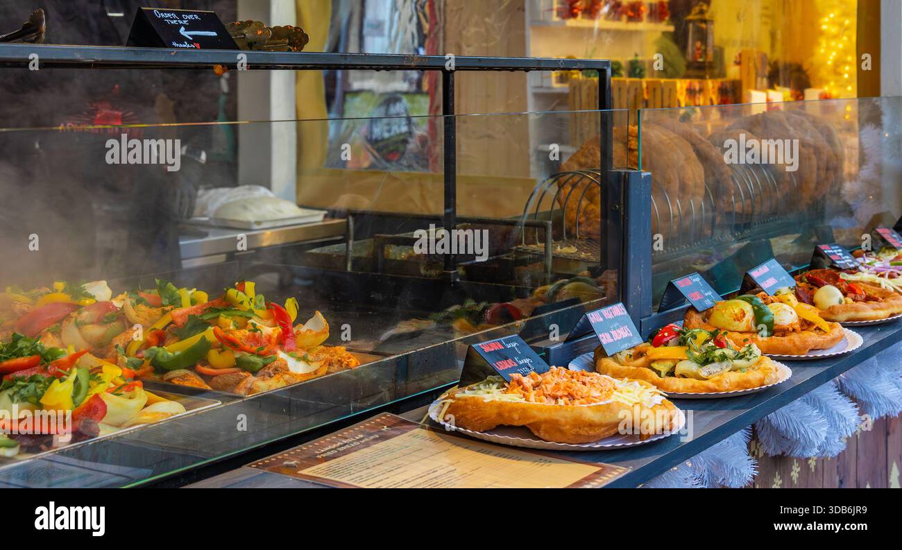 Close up of traditional Langos street food (Hungarian flatbread) with ...