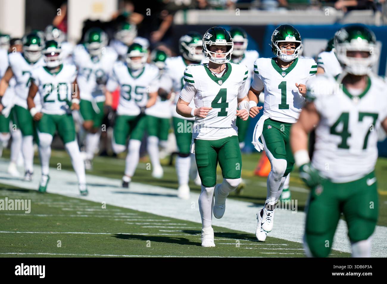 New York Jets quarterback Brady Cook (4) runs on field before the first ...