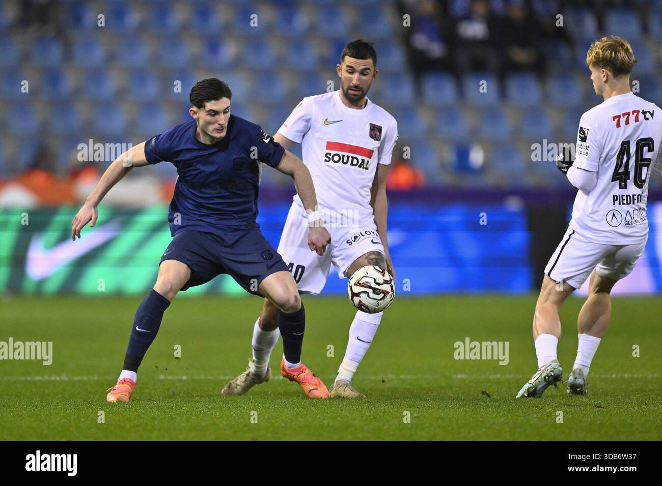 Genk's Robin Mirisola and Westerlo's Emin Bayram fight for the ball ...