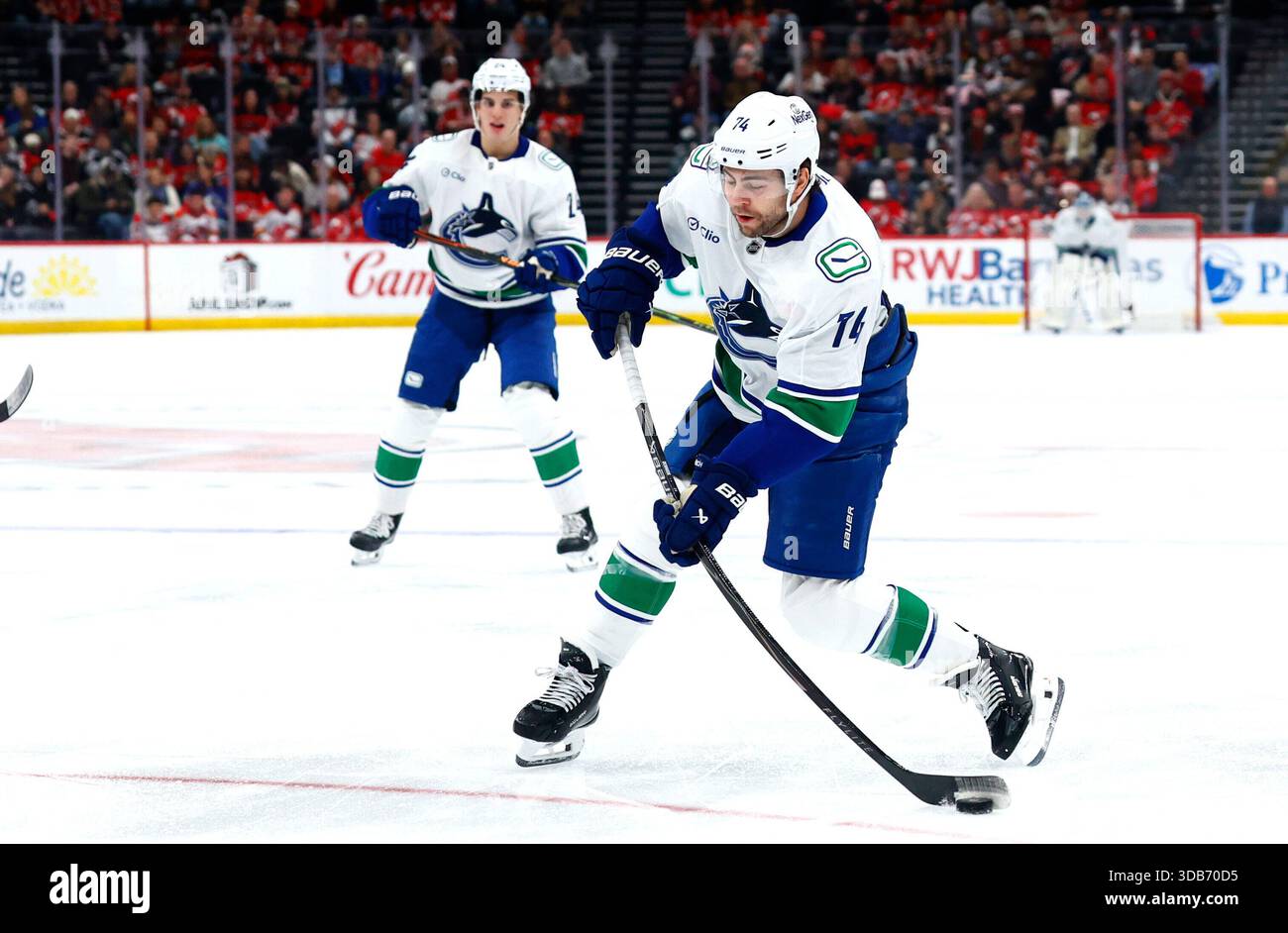 Vancouver Canucks left wing Jake Debrusk (74) shoots the puck during ...