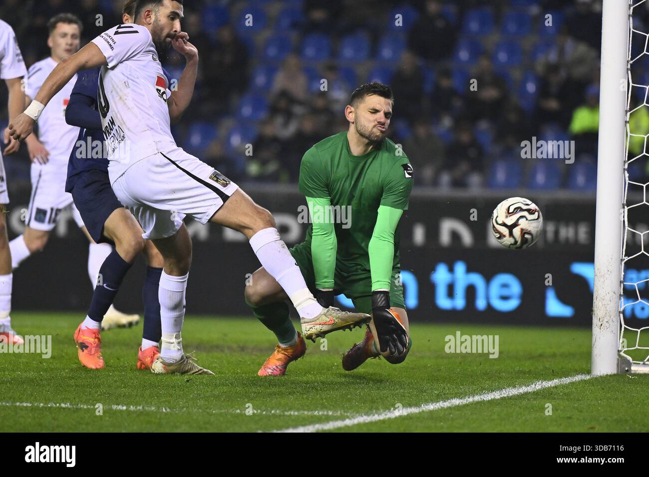Westerlo's Emin Bayram and Genk's goalkeeper Hendrik Van Crombrugge ...