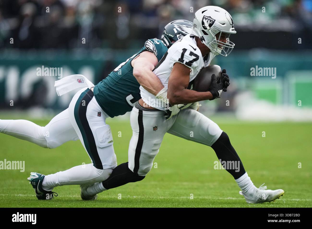 Las Vegas Raiders wide receiver Tyler Lockett (17) is tackled by ...