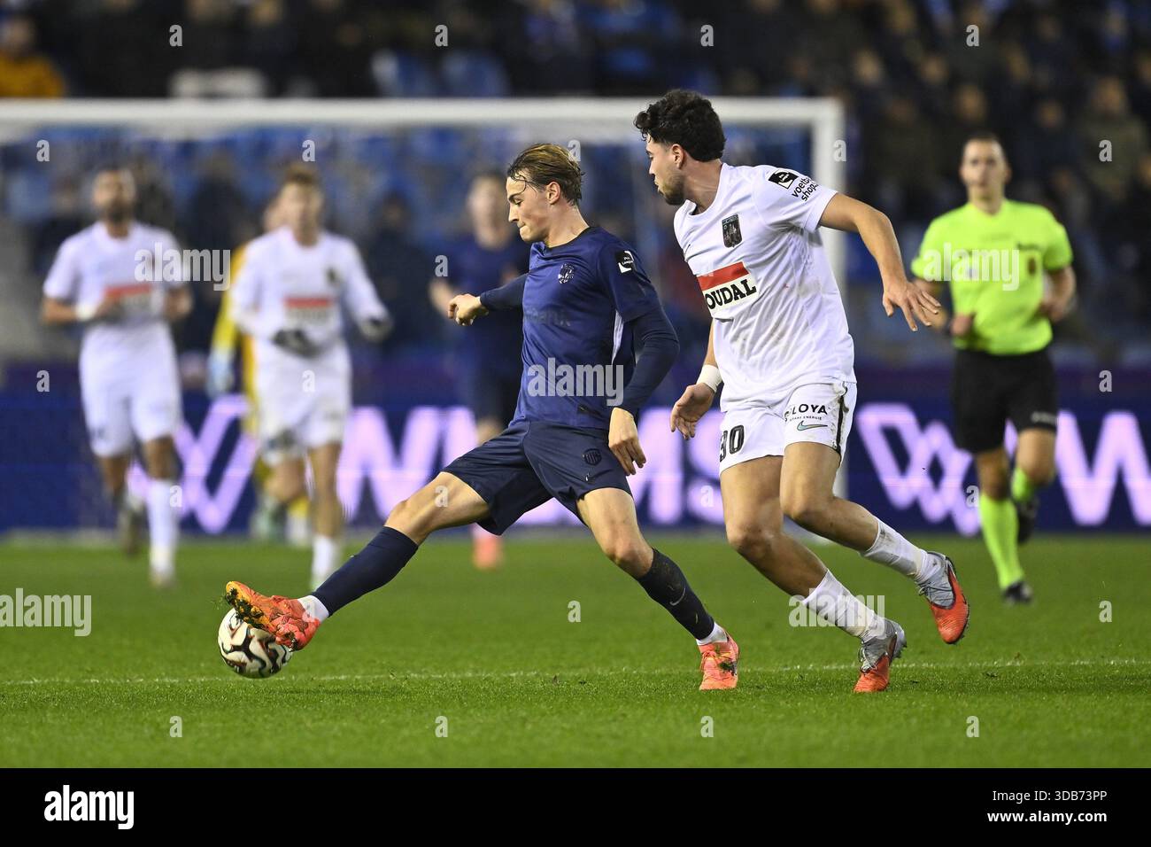 Genk's Matte Smets and Westerlo's Nacho Ferri fight for the ball during ...