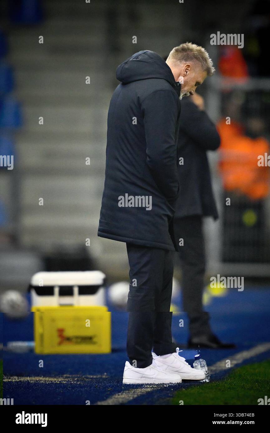 Genk's head coach Thorsten Fink, playing with a bottle of water and ...