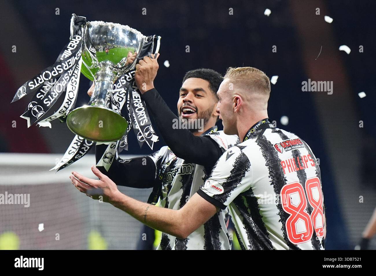 St Mirren's Miguel Freckleton (left) holding the trophy after the final ...