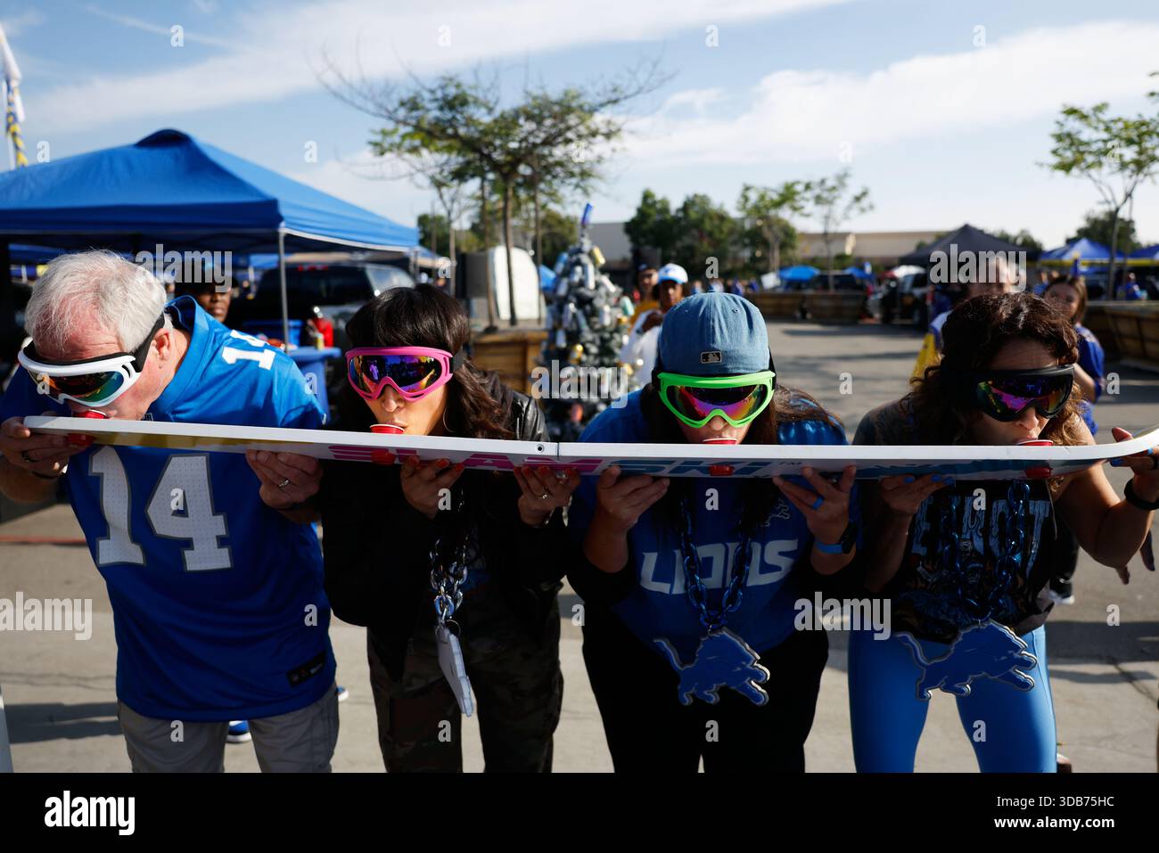 Fans tailgate before an NFL football game between the Los Angeles Rams ...